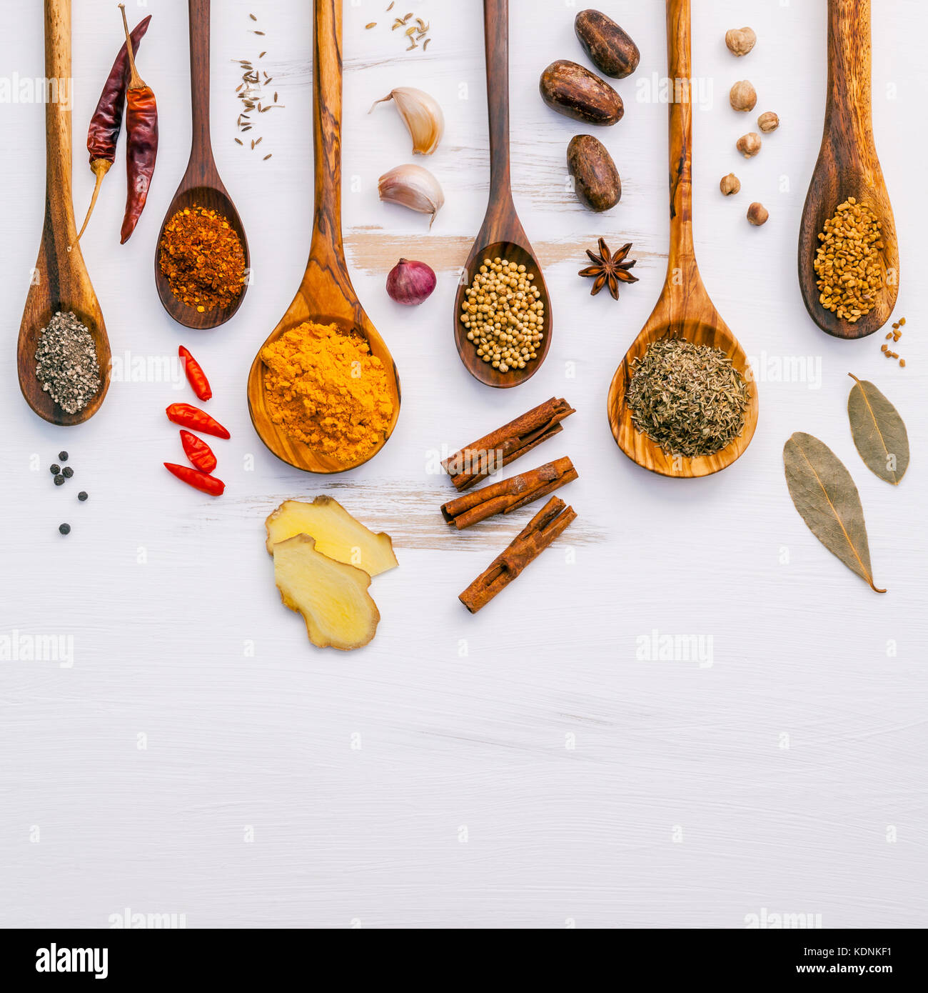 Various herbs and spices in wooden spoons. Flat lay of spices ...