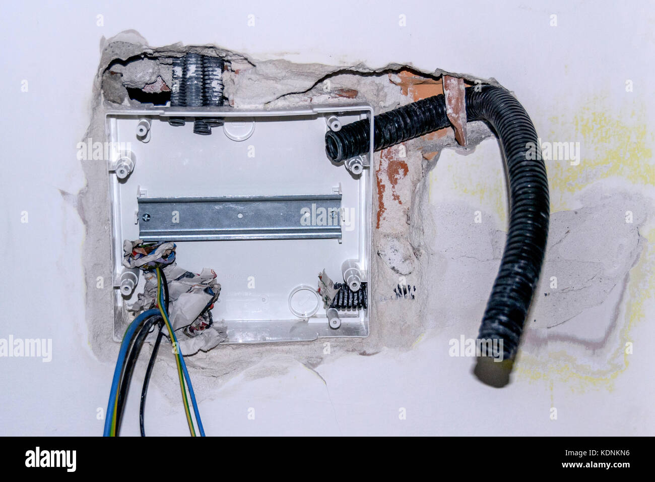 installation of electrical home system with wall mounted cassette Stock ...