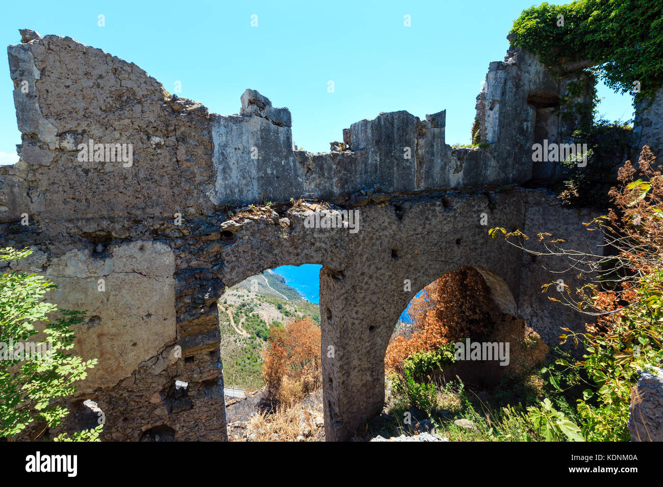 The ruins of the original settlement of Maratea on a rocky escarpment ...