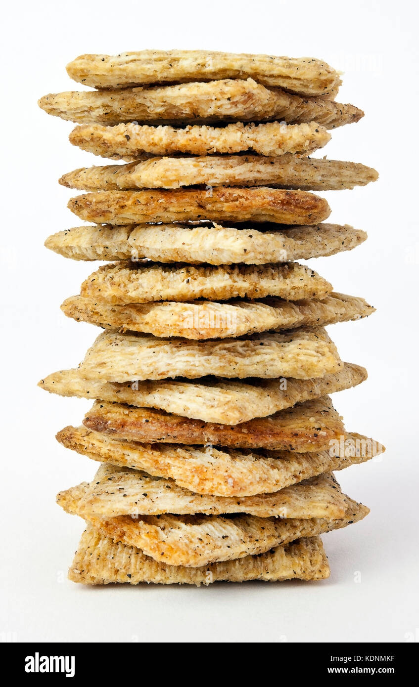 Tall stack of wheat biscuits crackers. Vertical Stock Photo - Alamy