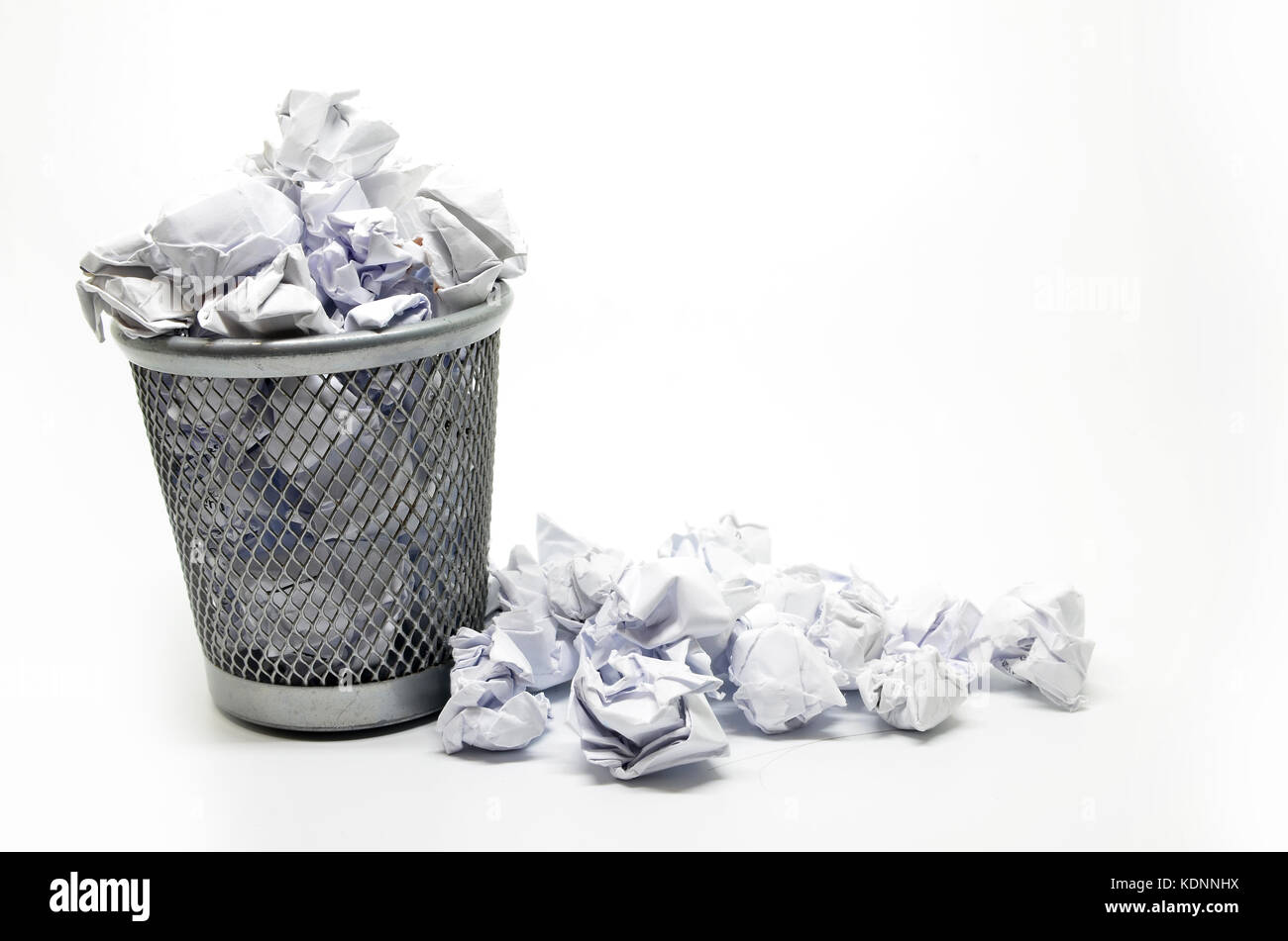 Garbage bin with paper waste isolated on white Stock Photo - Alamy
