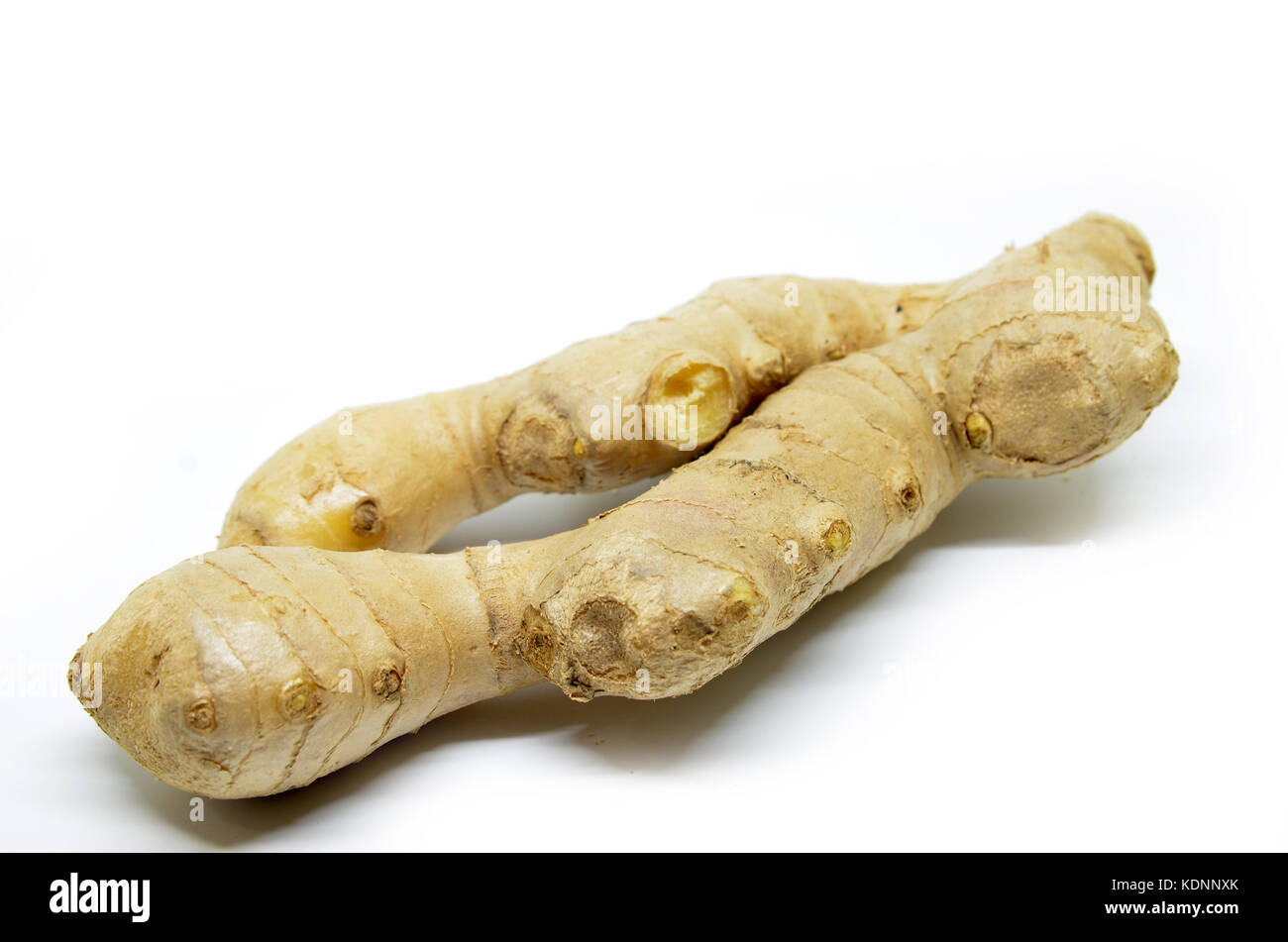 Fresh ginger isolated on a white background Stock Photo - Alamy