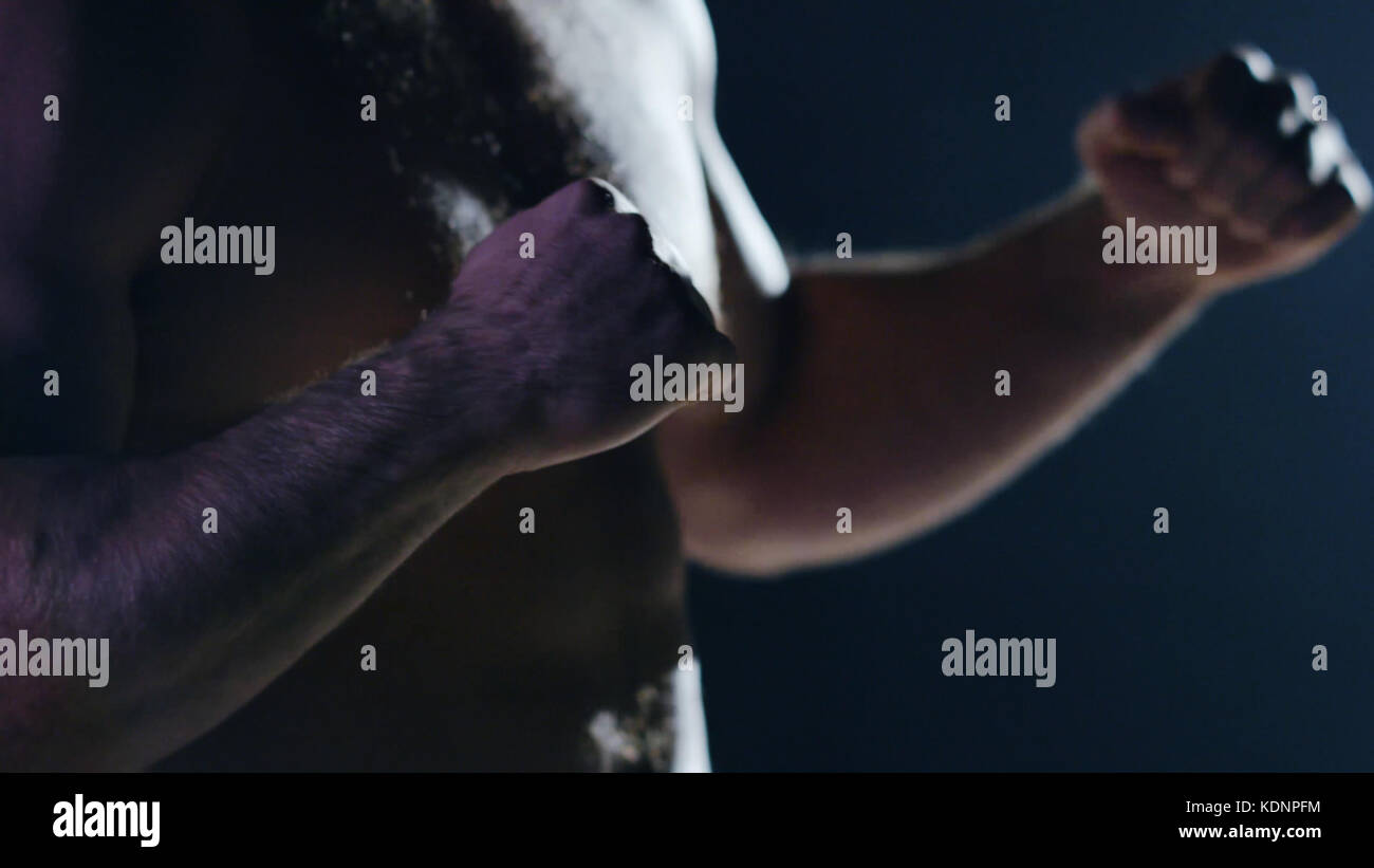Boxing man ready to fight. Boxer with strong hands and clenched fists ...