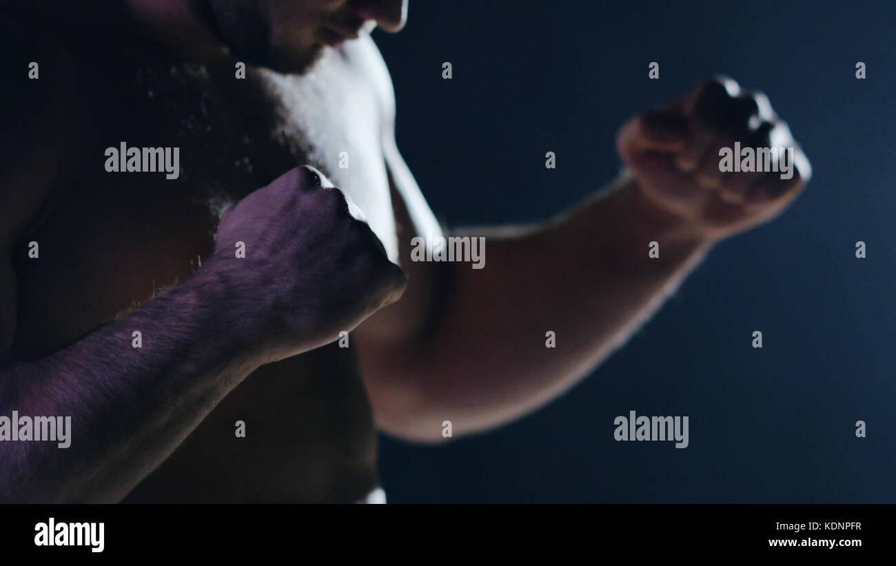 Boxing man ready to fight. Boxer with strong hands and clenched fists ...