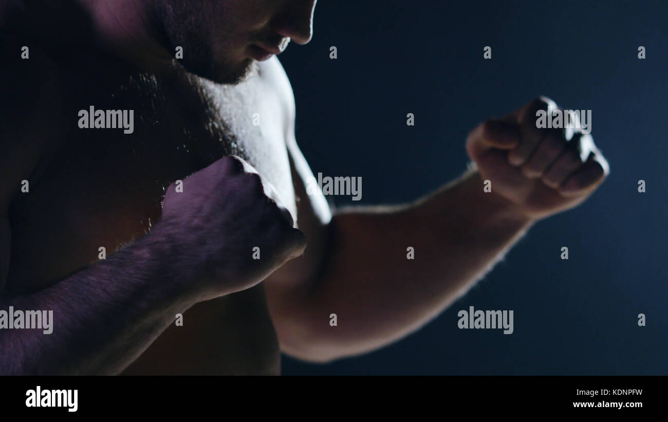 Boxing man ready to fight. Boxer with strong hands and clenched fists ...