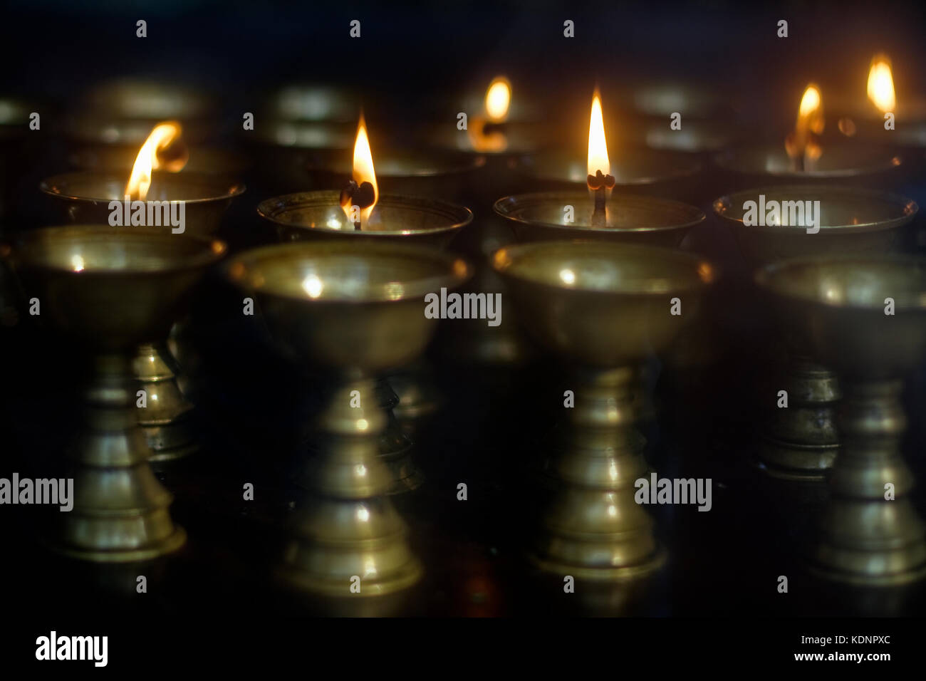 Tibetan Buddhist butterlamps, close up Stock Photo - Alamy
