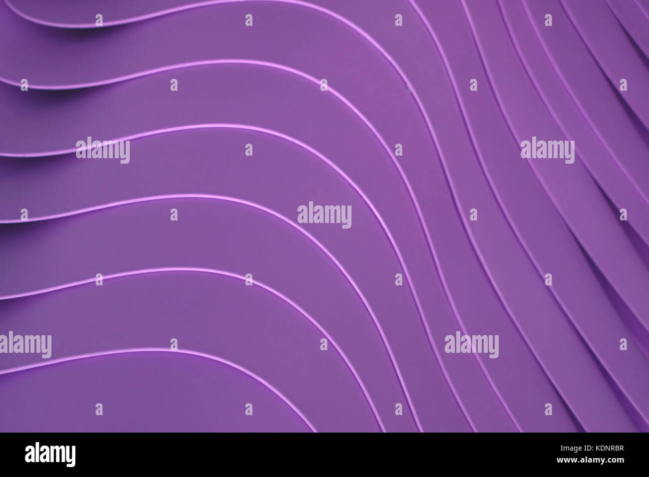 Artistic curved lines of the piled up purple color plastic bowls, for ...