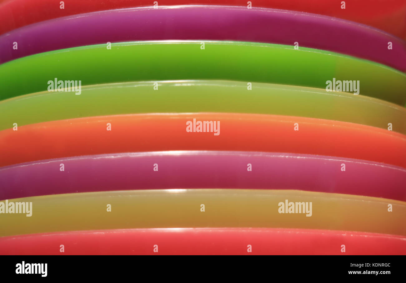 Piled up colorful plastic plates, Abstract Background Stock Photo - Alamy