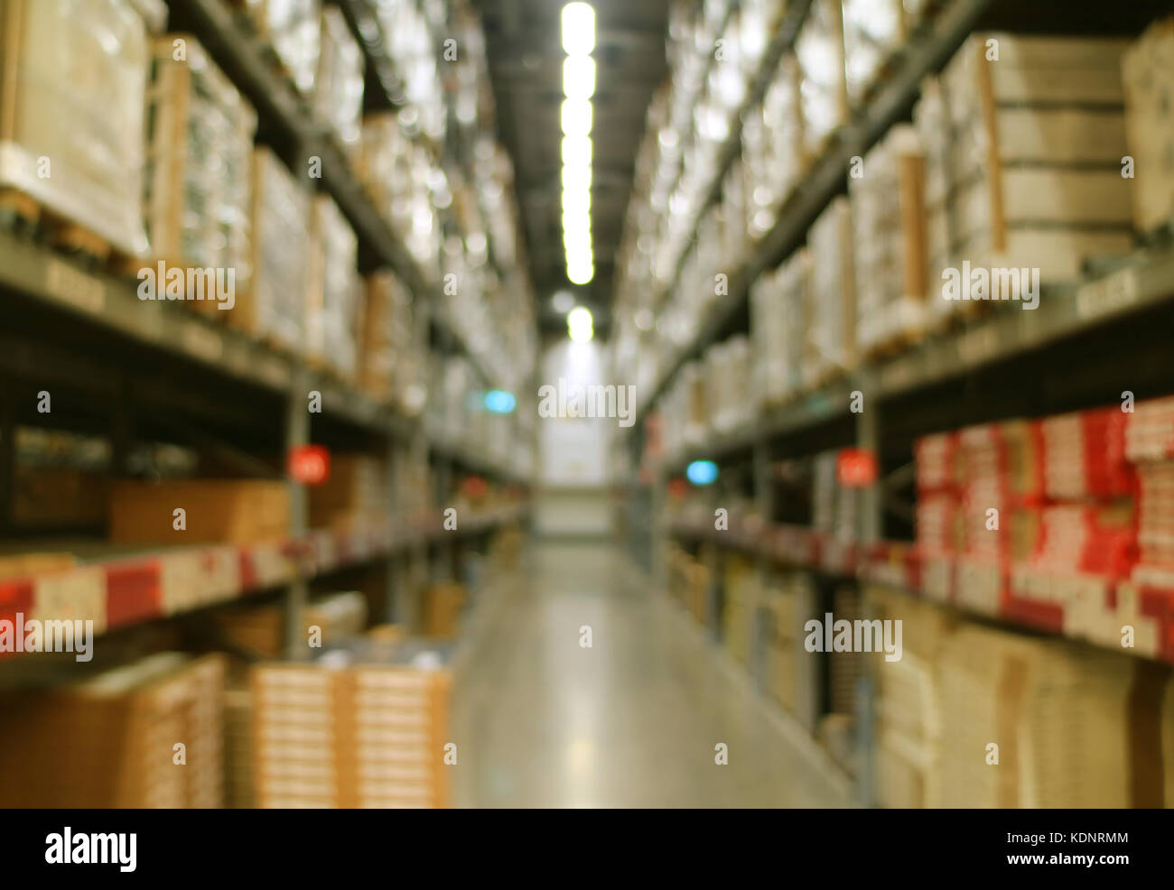 Abstract blurred of the huge warehouse storage shelves full of ...