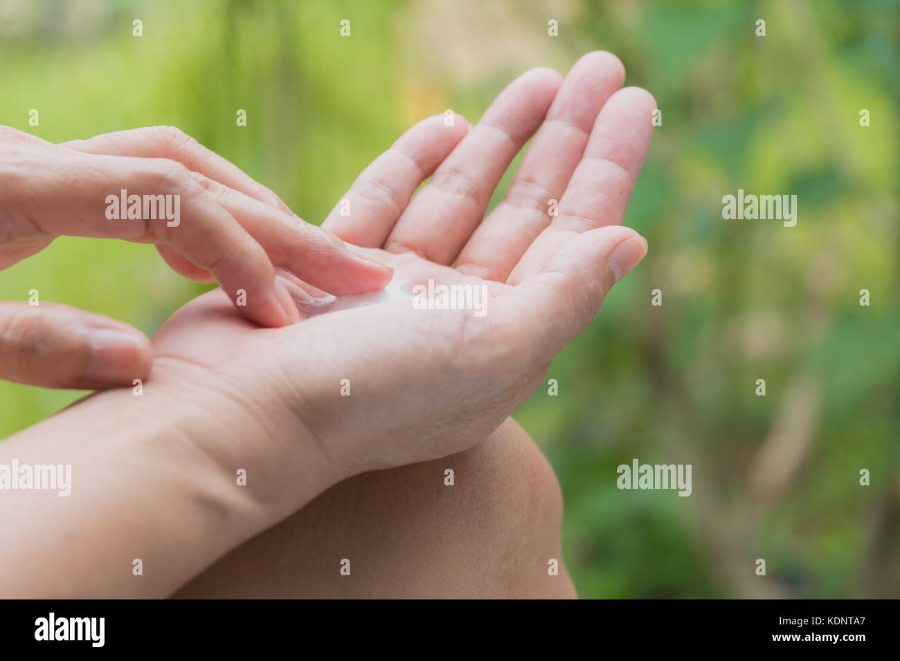 Woman apply sun cream hand hi-res stock photography and images - Alamy
