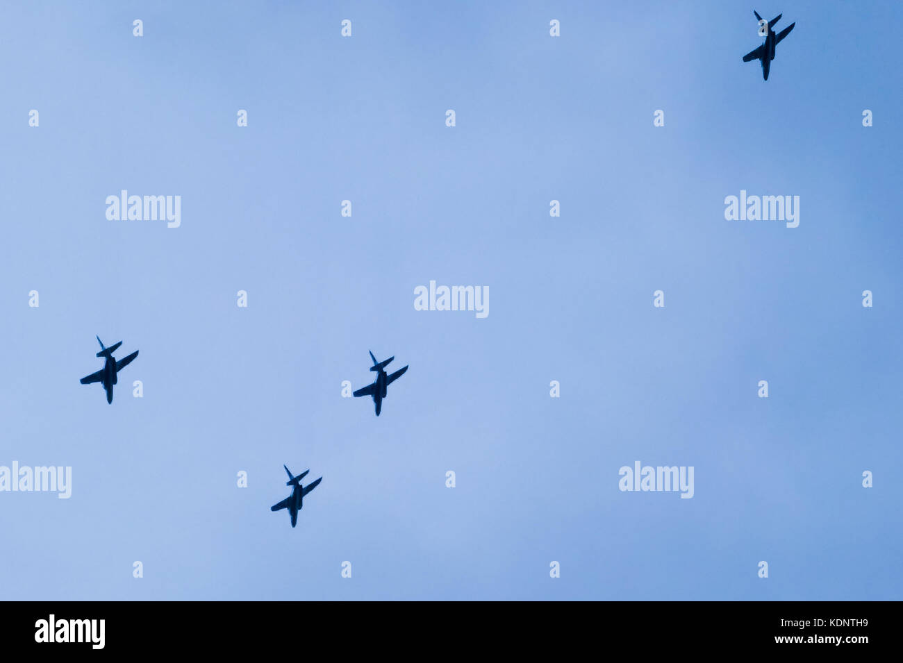 A flight pattern of a jet fighter that glides while scattering and ...