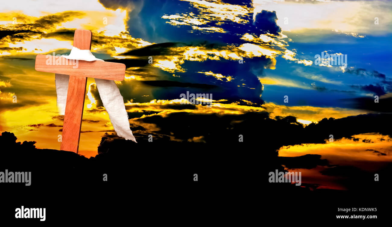 Dramatic lighting on Christian cross as storm clouds background Stock ...