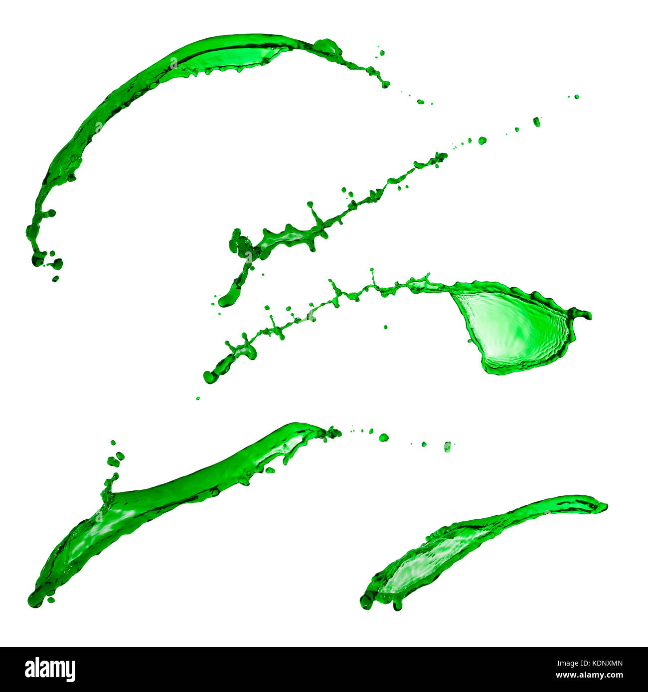 Elegant collection of flying liquid splashes green color on white ...