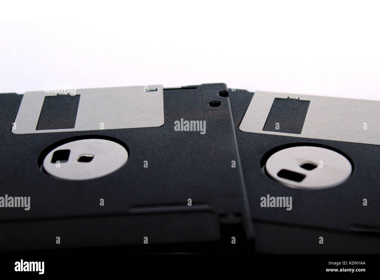 Detail of black floppy disks isolated on white background (back side ...
