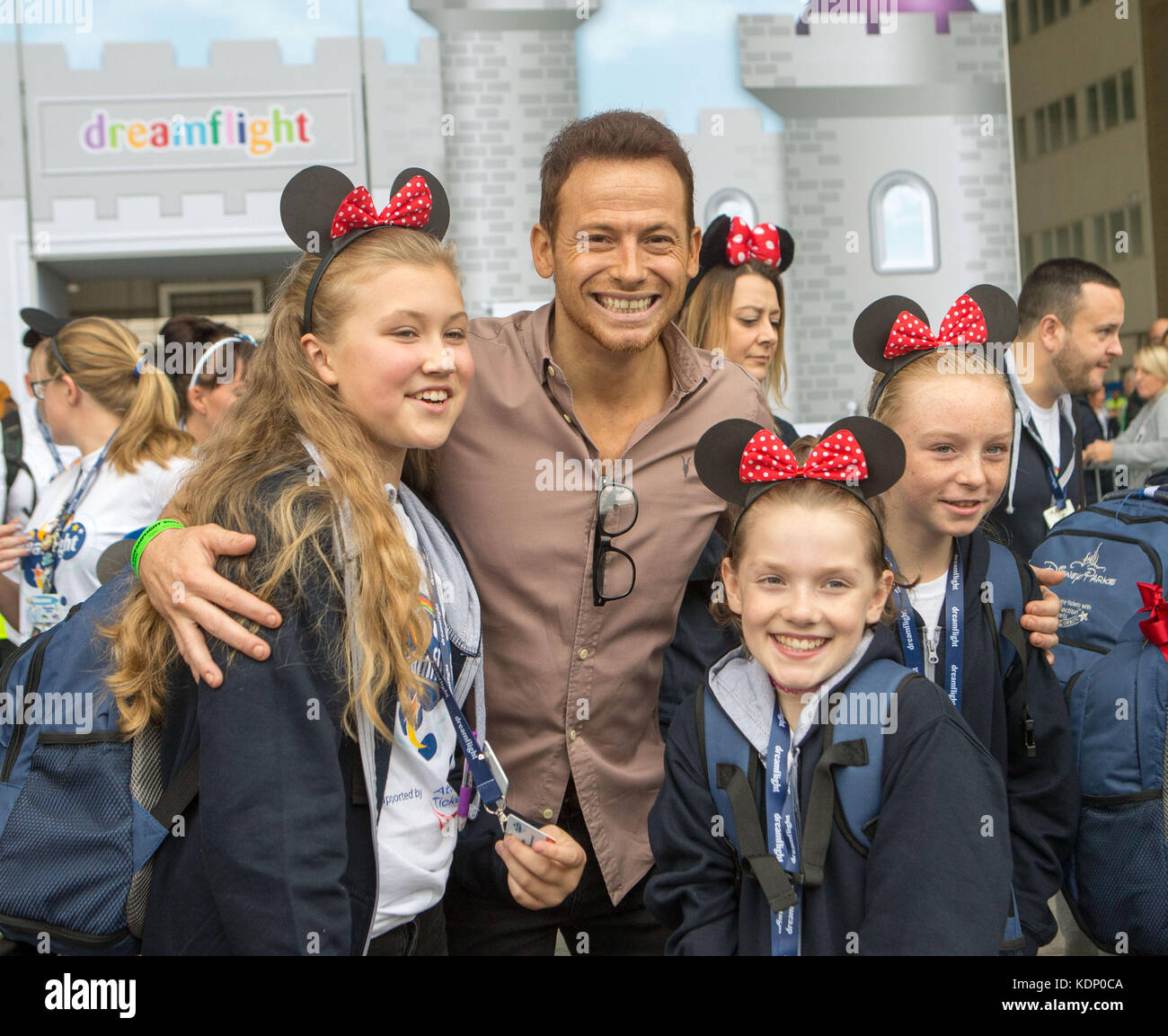 Joe Swash with children before they board the Dreamflight trip to ...
