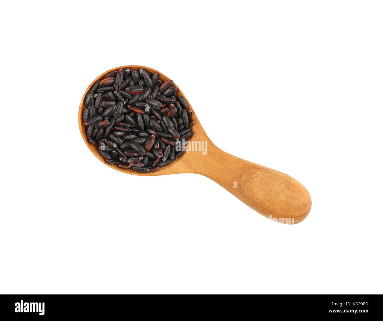 Black purple raw unhulled long grain rice in wooden scoop isolated on ...