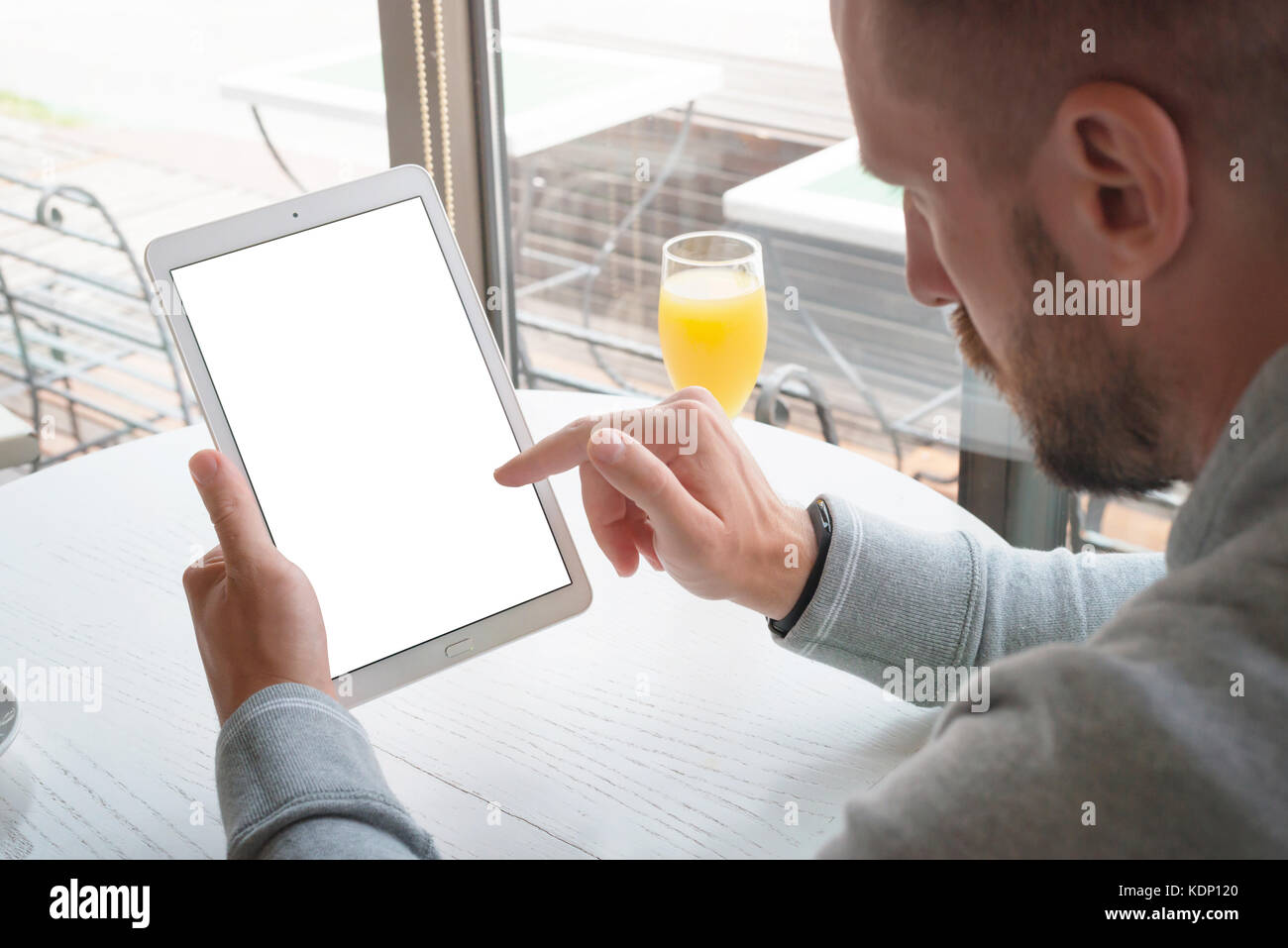 Tablet mockup. Man holding tablet in vertical position. Touch screen ...