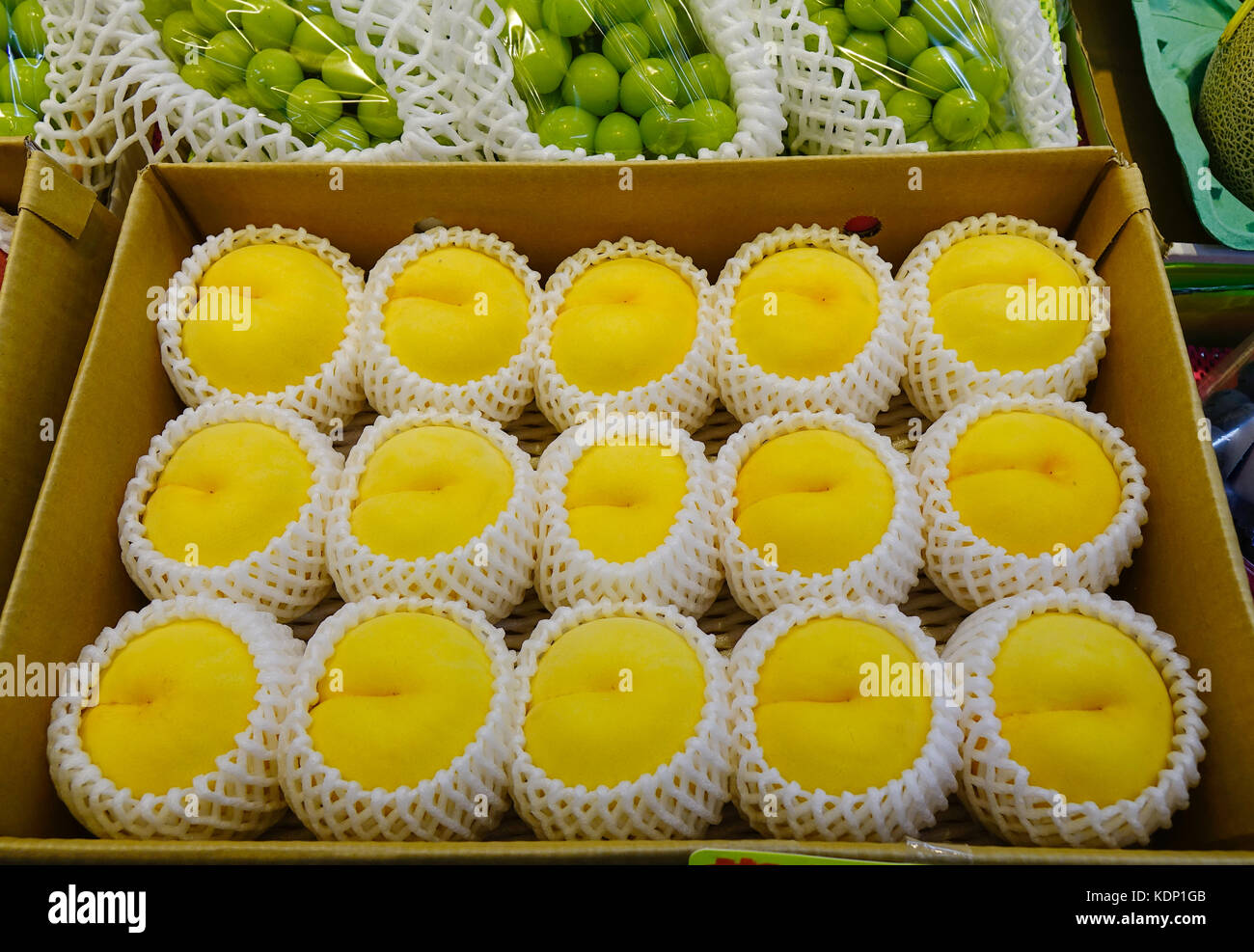 Raw yellow peaches for sale at local market in Hakodate, Japan Stock ...