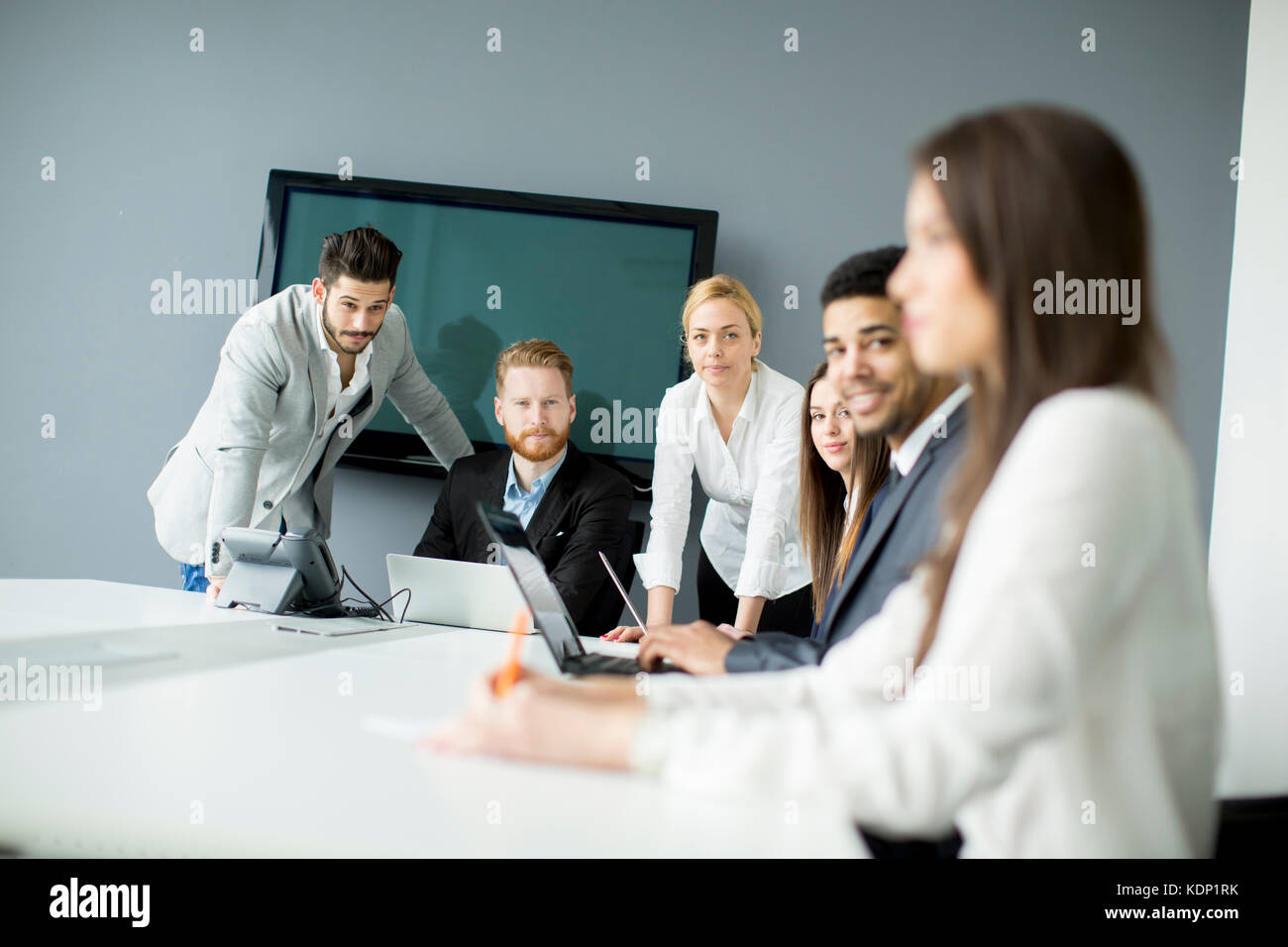 Business team working together in modern office to achieve better ...