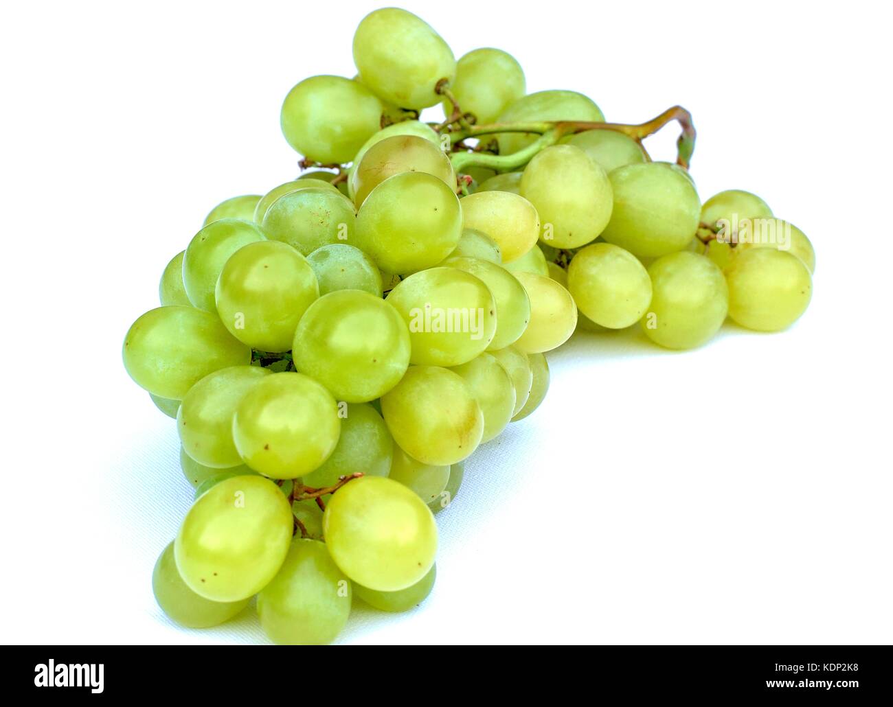 Ripe white grapes on a white background Stock Photo - Alamy