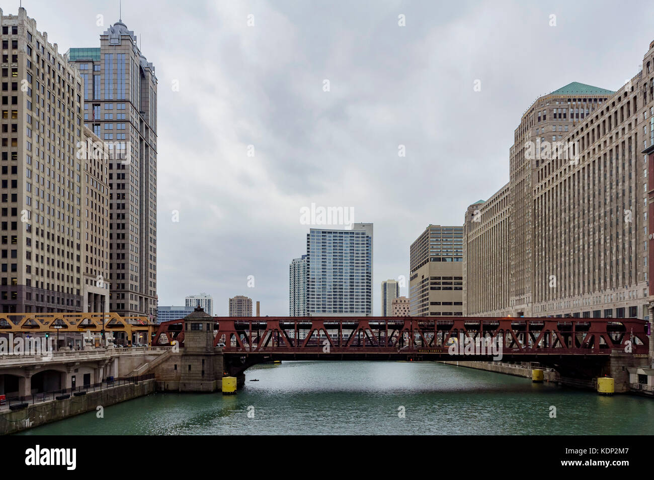 Afternoon cloudy view with skyscraper and red bridge of Chicago skyline ...