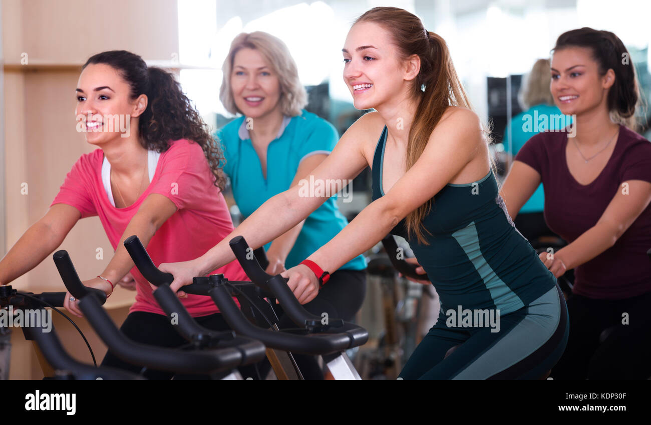 Positive females of different age training on exercise bikes together ...