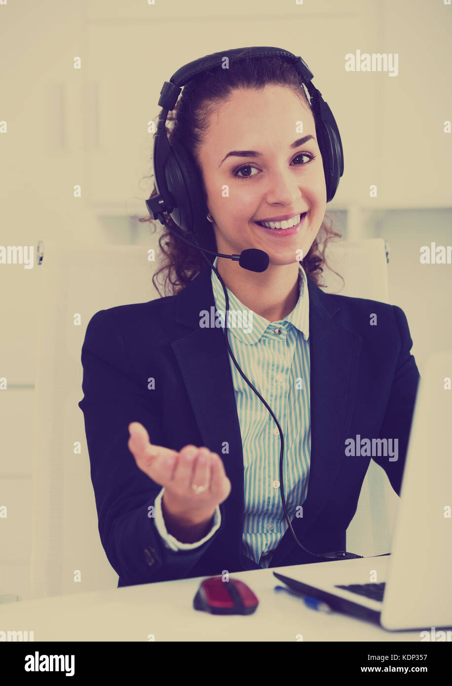 Happy woman call center operator working with client by headset and ...
