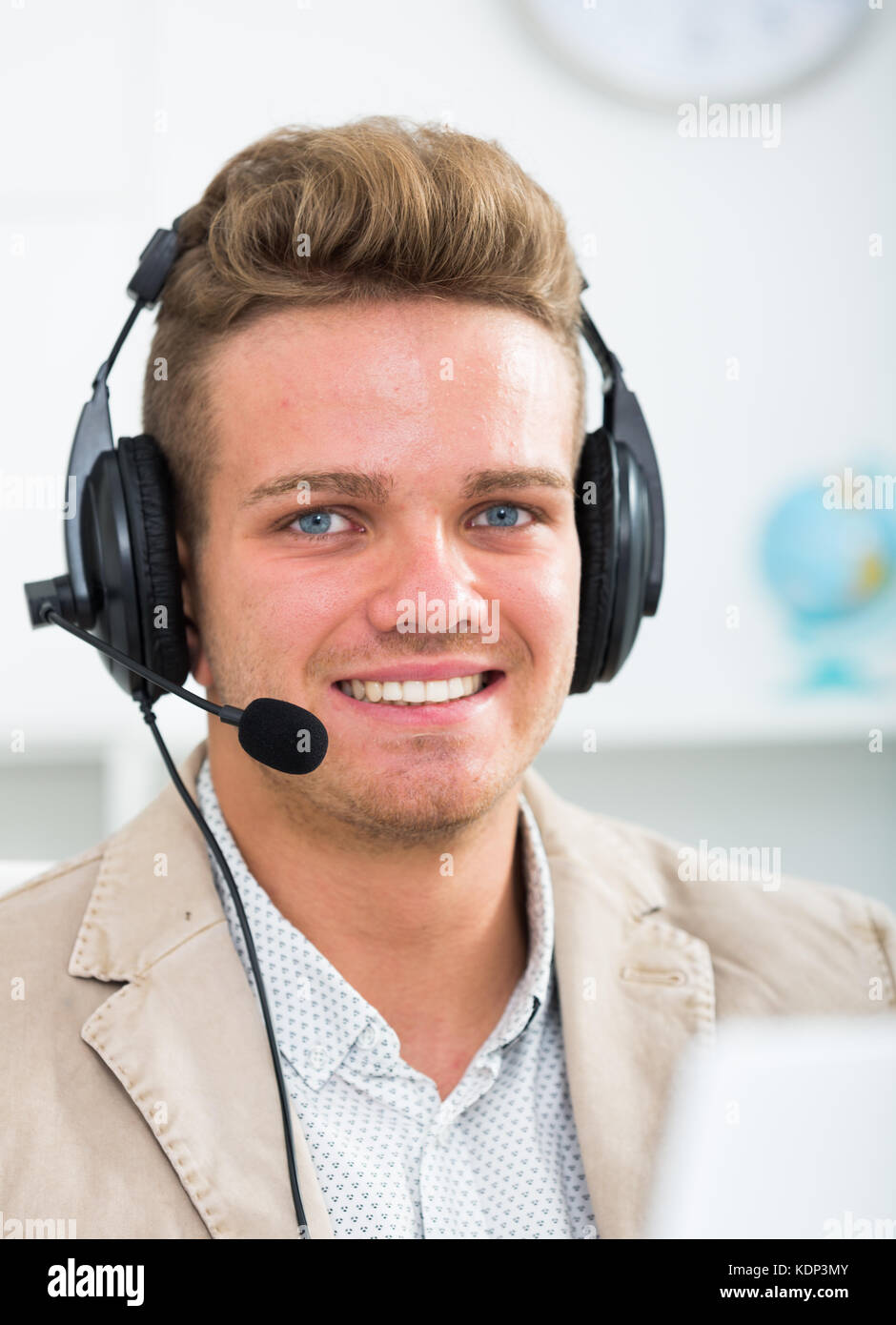 Portrait of male call centre operator working in modern office Stock ...