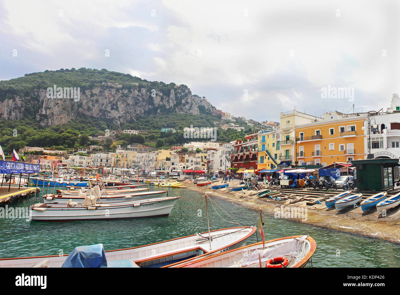 Small boats docked on famous Italian summer seaside marina in Capri ...