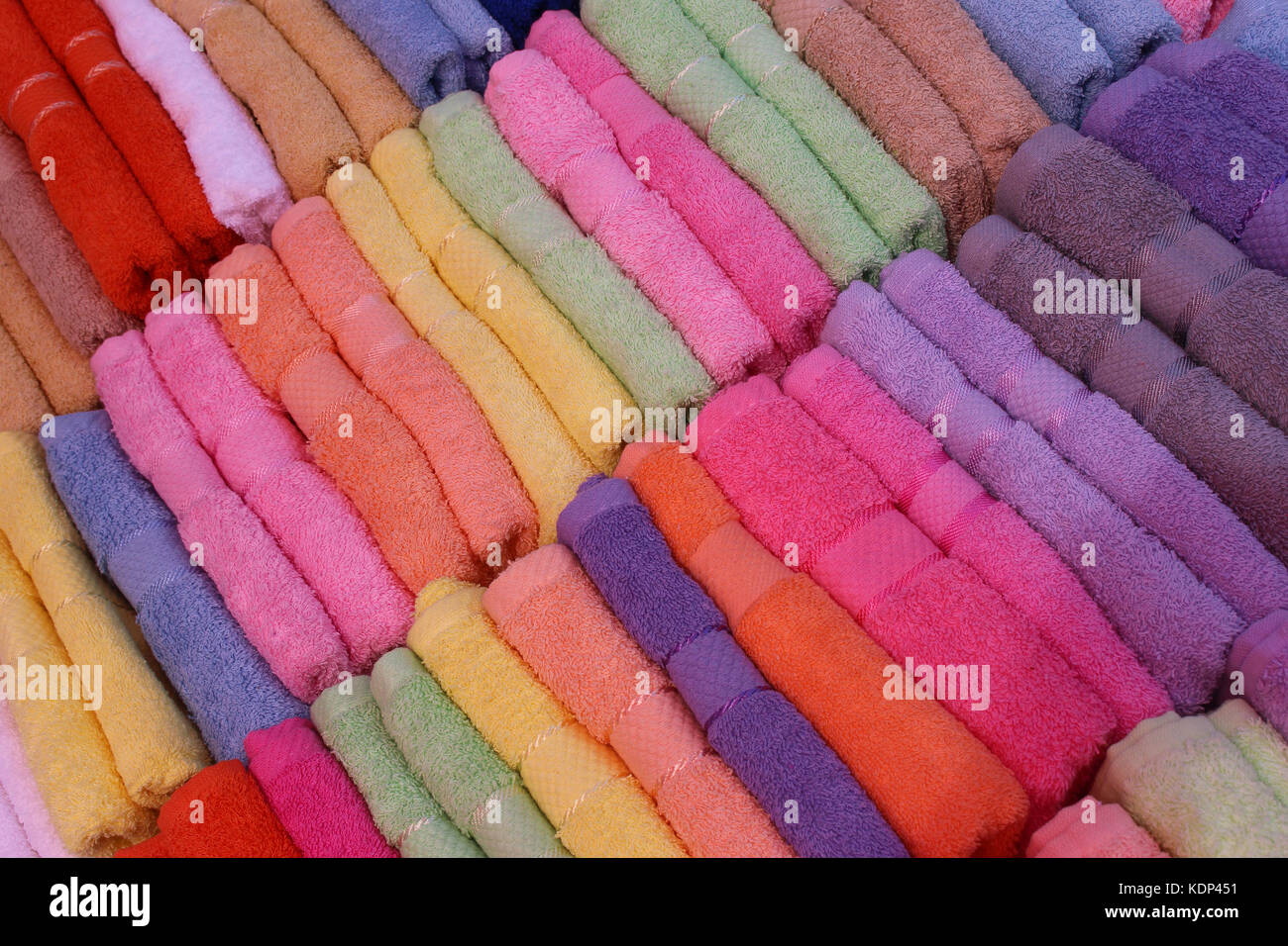 Carefully arranged thick cotton bright color towels Stock Photo - Alamy