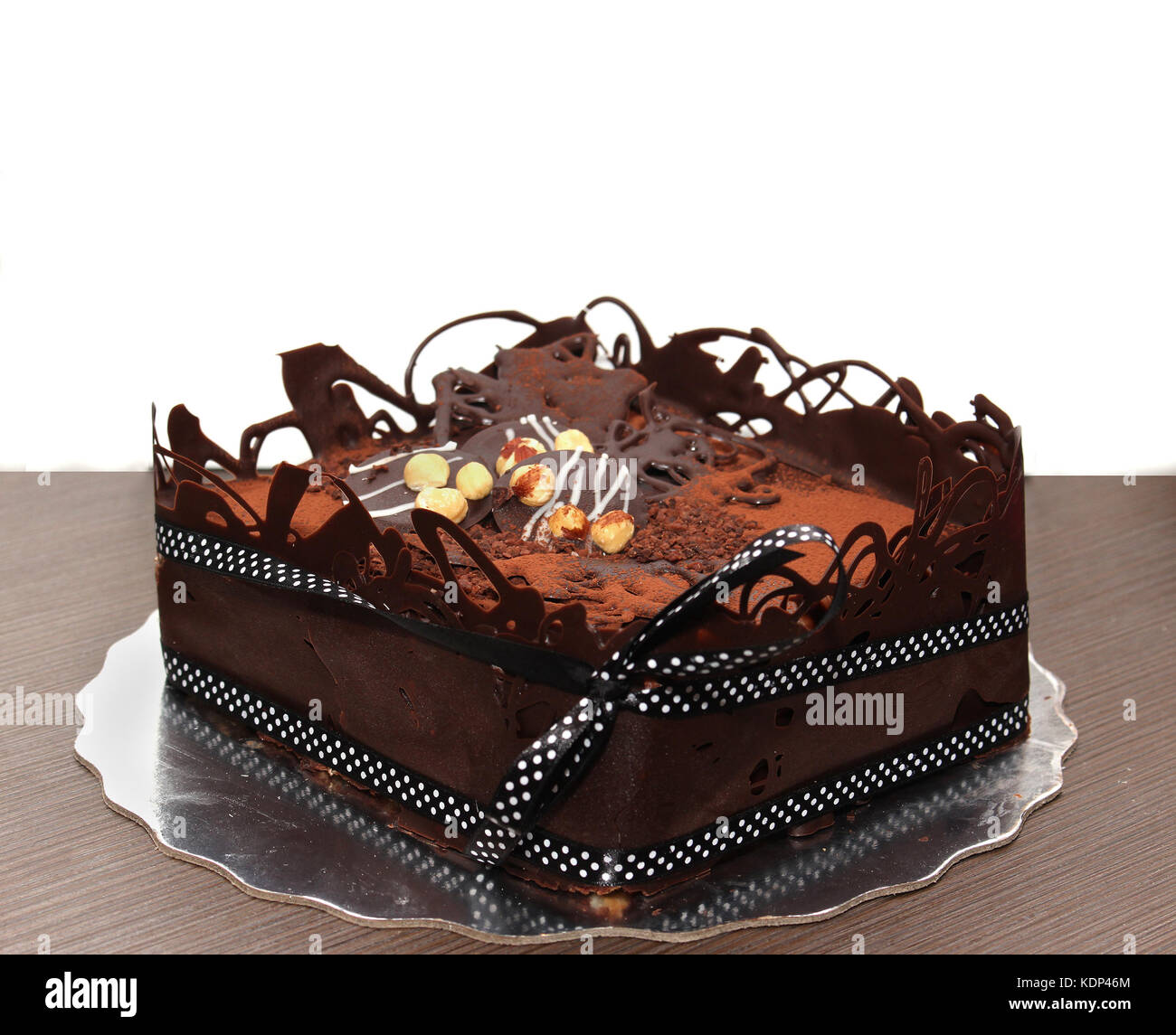 Delicious chocolate cake with decorative ribbon tied around Stock Photo ...