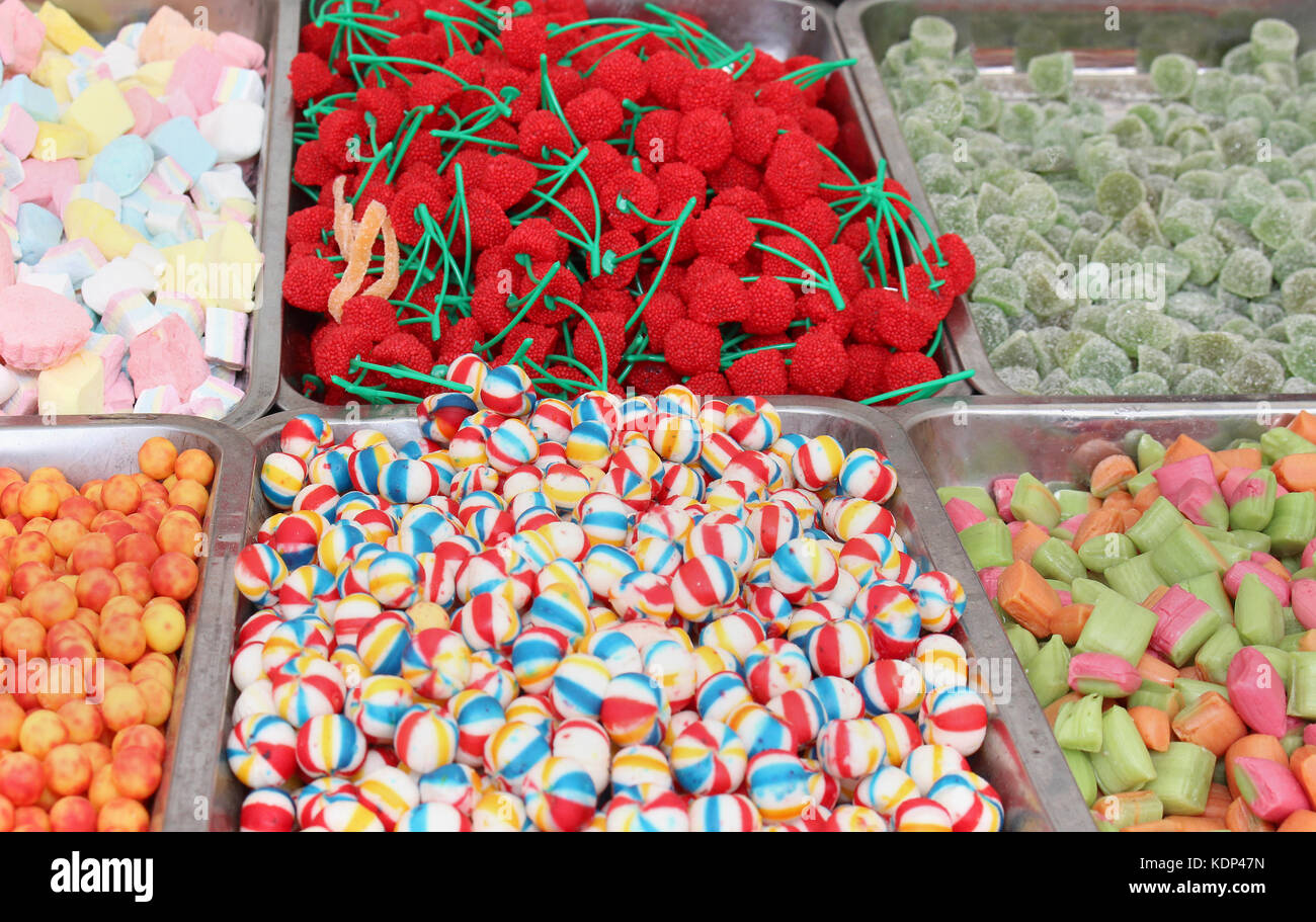 Piles of colorful colorful candy treats on market stall Stock Photo - Alamy