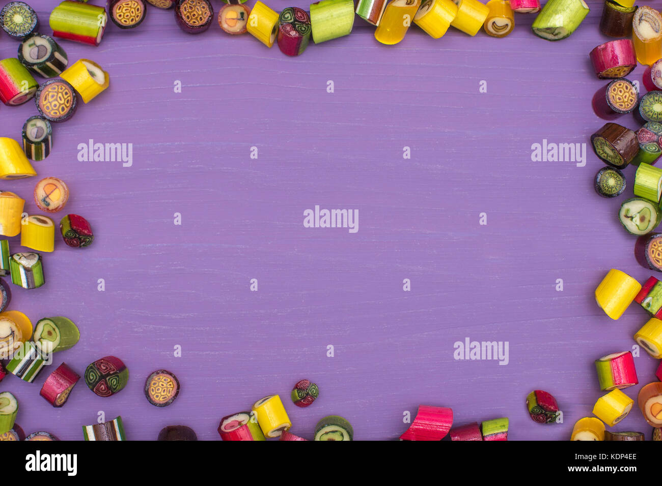 A round frame made of colored caramel candies Stock Photo - Alamy