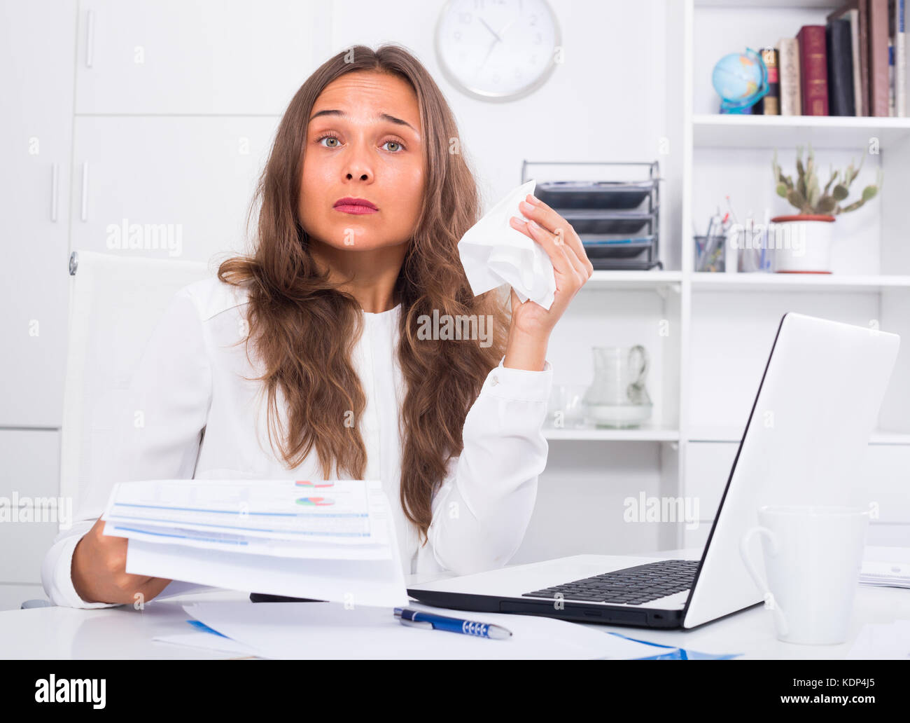 tired young woman employee sitting with computer and having work ...