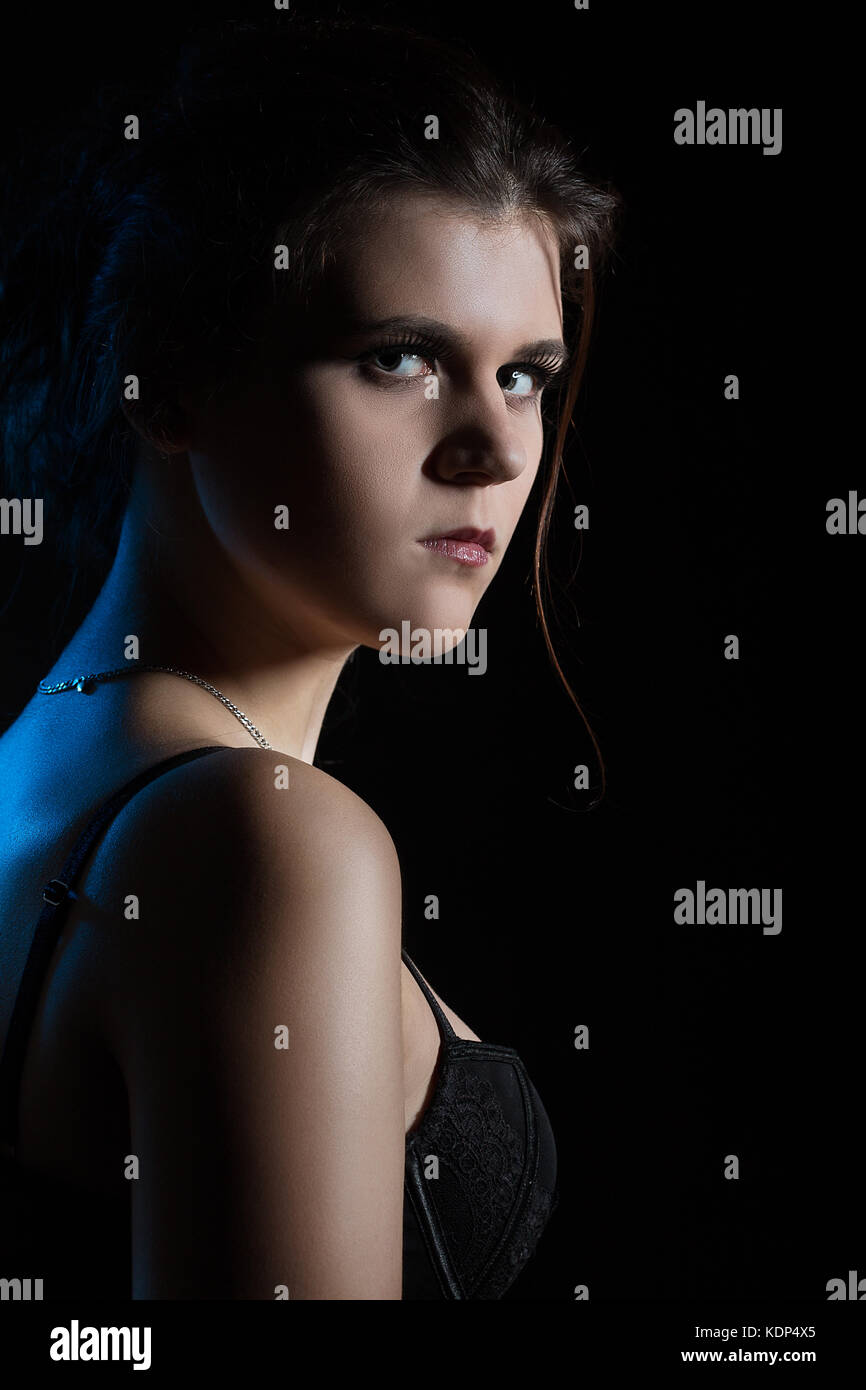 Girl looking back over shoulder hi-res stock photography and images - Alamy