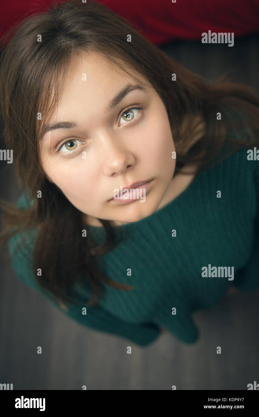 sad beautiful young woman looking up at camera Stock Photo - Alamy