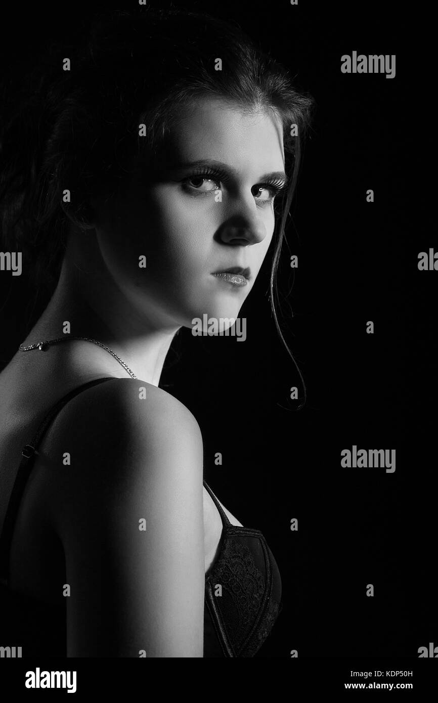 Women looking over shoulder Black and White Stock Photos & Images - Alamy