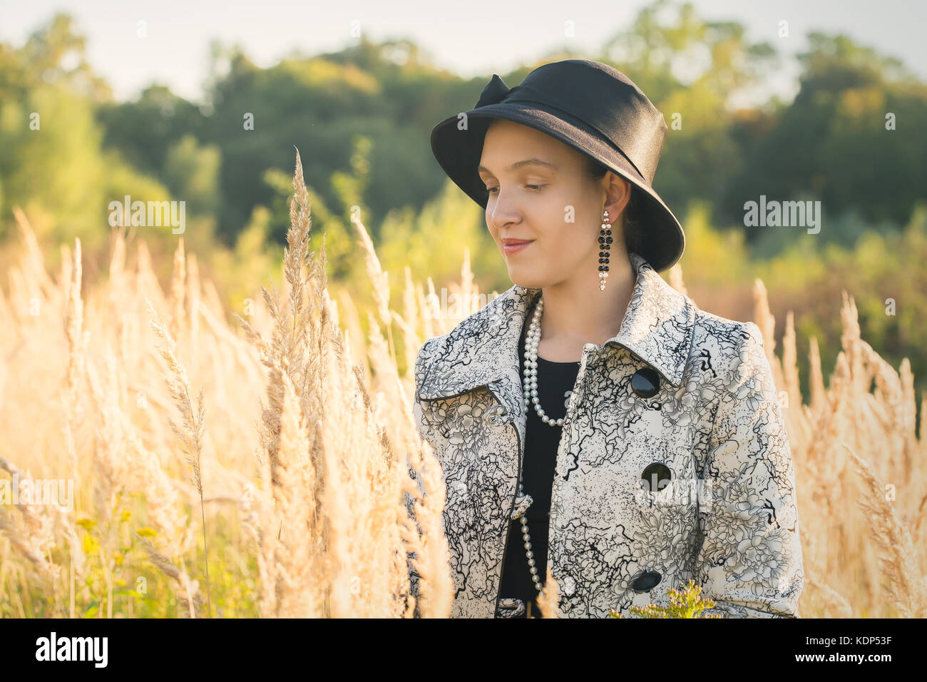 attractive young luxury woman walking at autumn dry grass Stock Photo ...