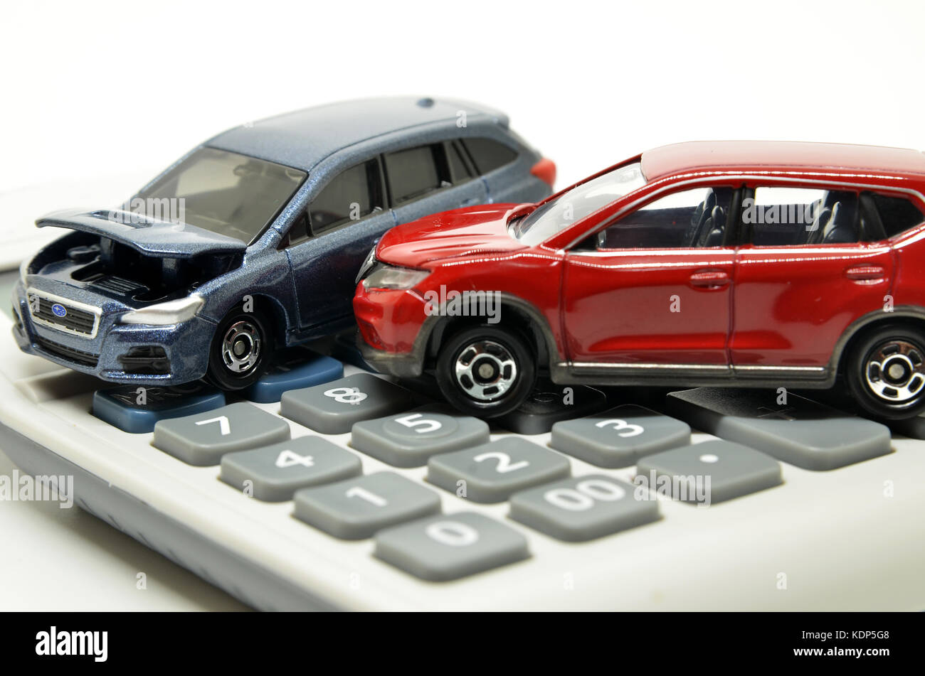 Car insurance concept with calculator on white background Stock Photo ...