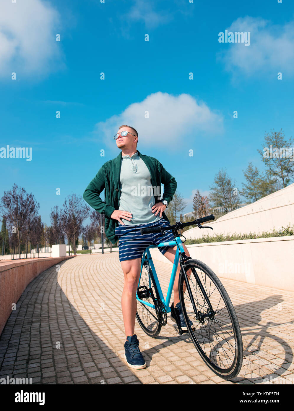 stylish man riding a Bicycle Stock Photo - Alamy