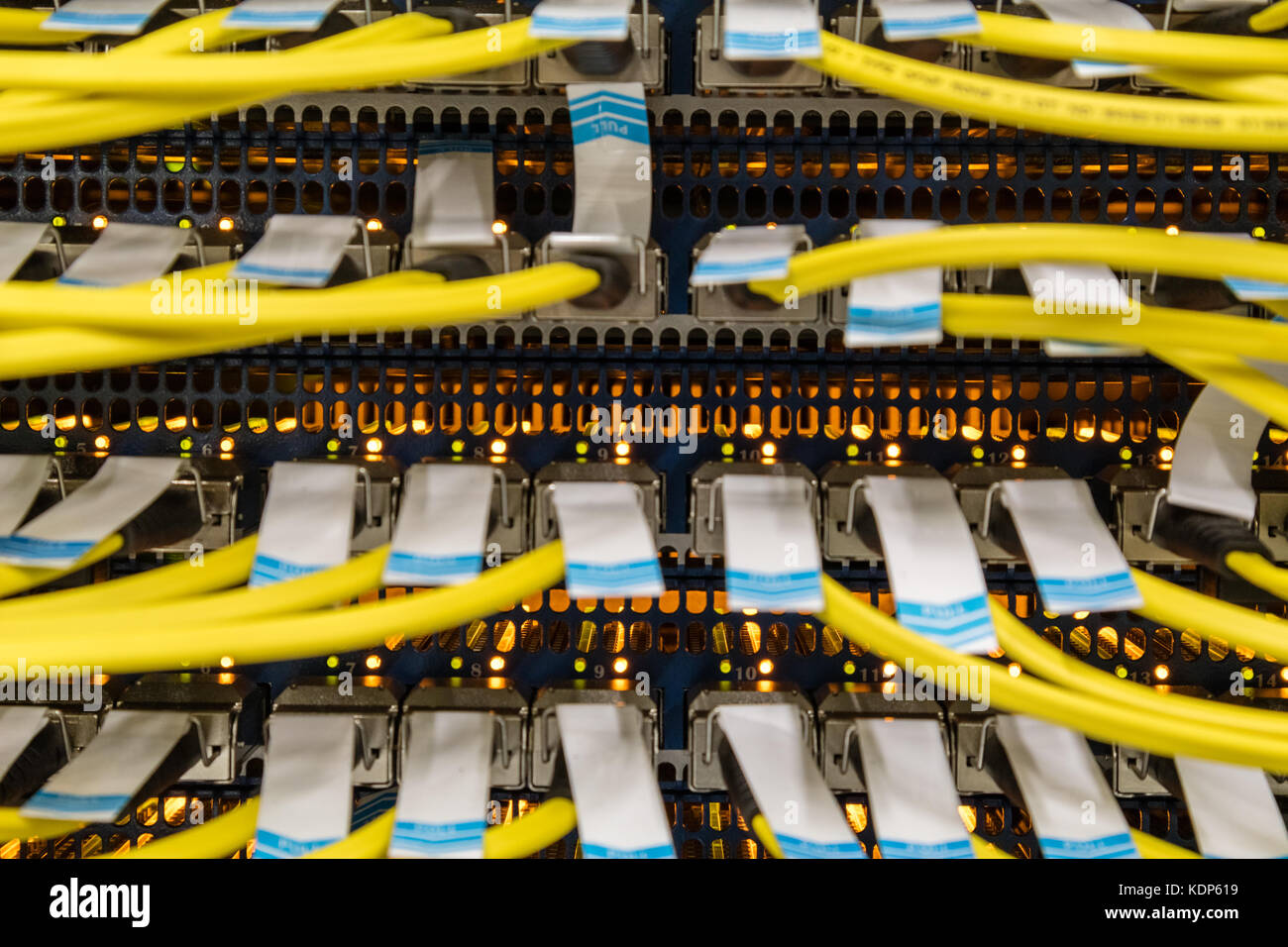 fibre optic cables connected to a network switch Stock Photo - Alamy