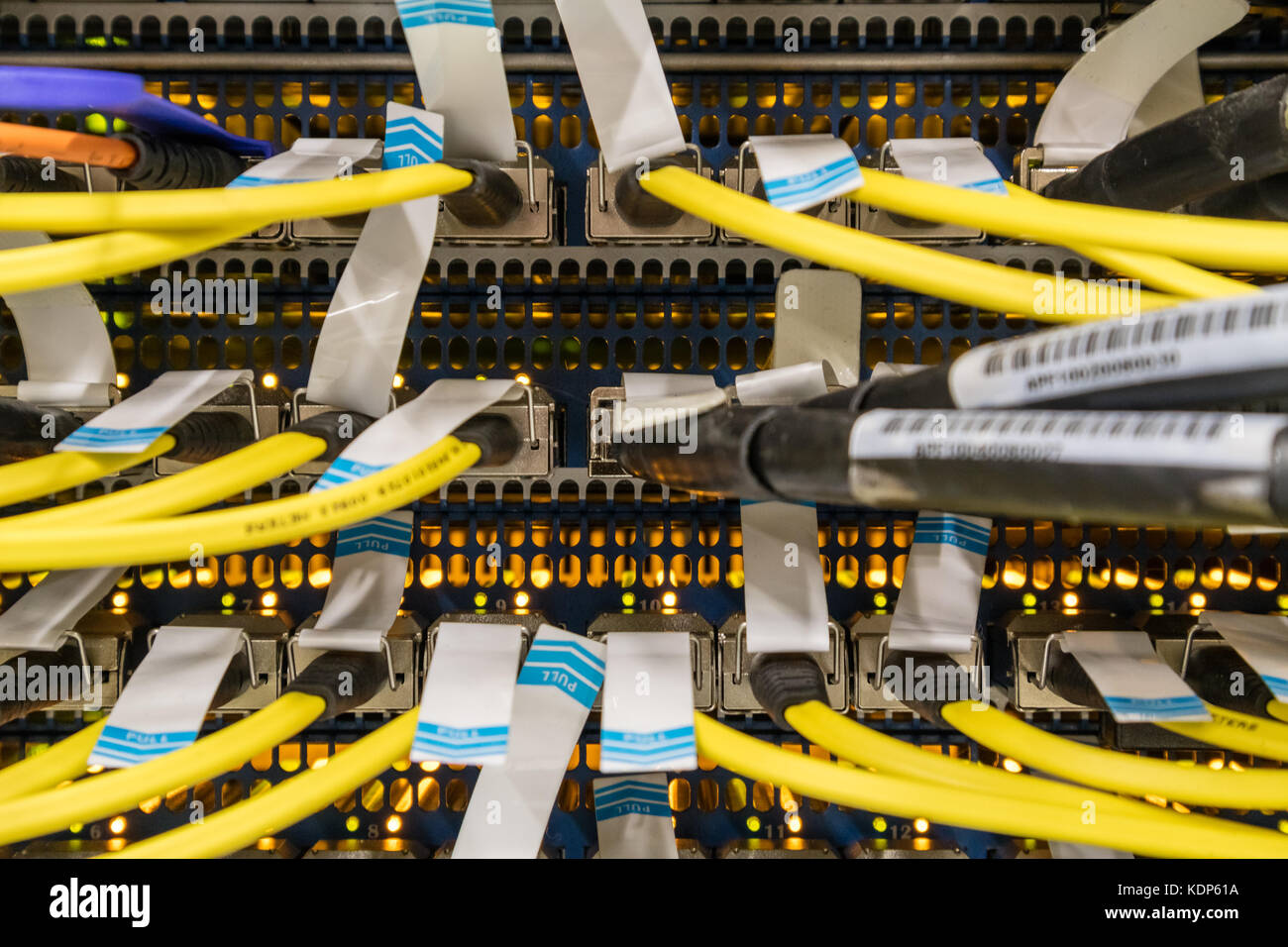 fibre optic cables connected to a network switch Stock Photo - Alamy