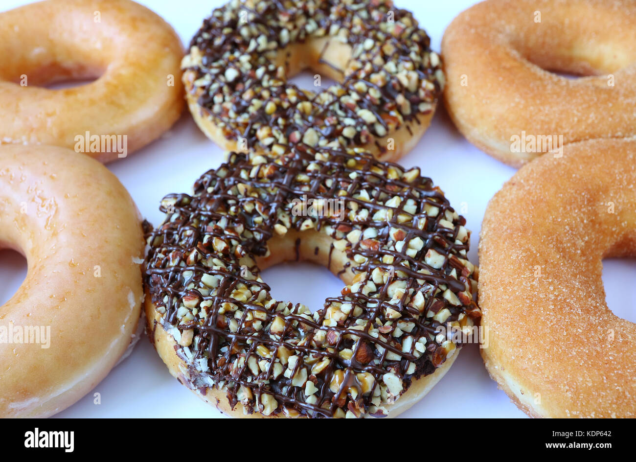 Close-up of six doughnuts in different flavors, with selective focus ...