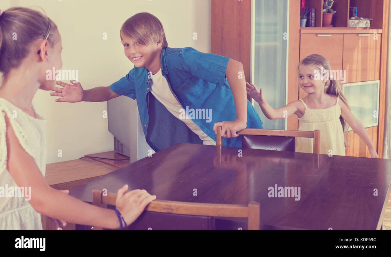 Joyful happy happy child chasing other kids to tag or touch them Stock ...