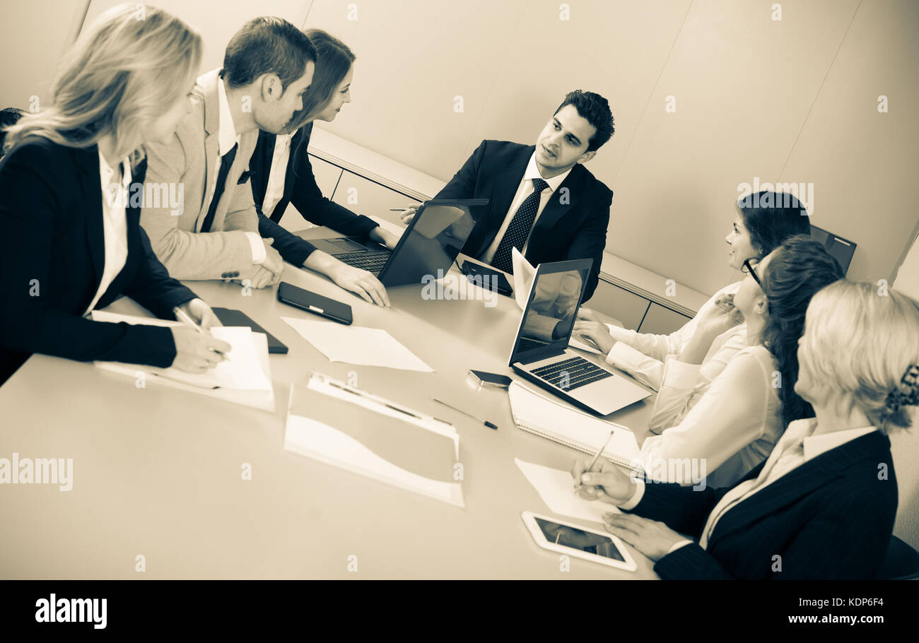 Chief with professional happy european officials discussing preparing ...