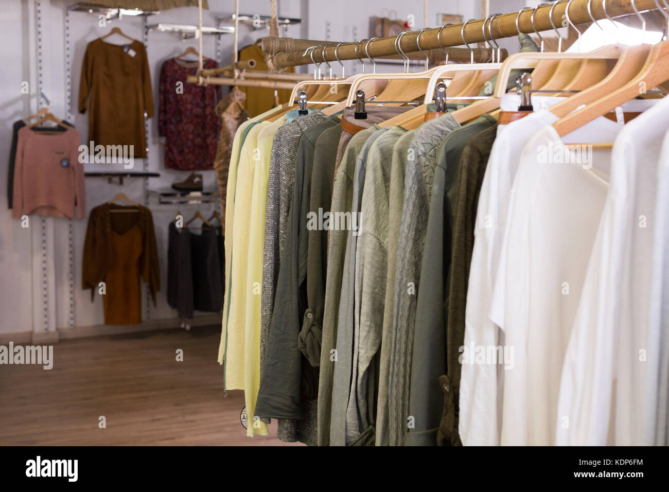 Assortment of warm clothing in modern garment store interior Stock ...