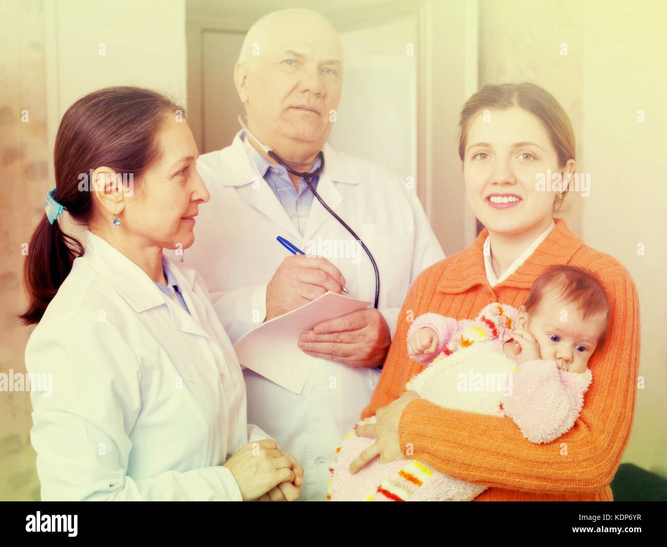 mother with three months baby in arms and pediatrician doctors in ...