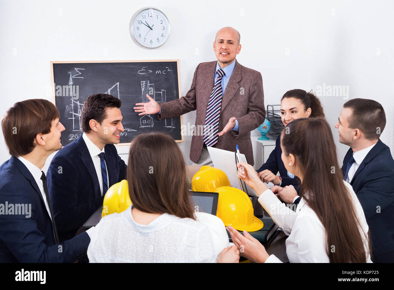 Team of successful creative engineers and architects discussing ...