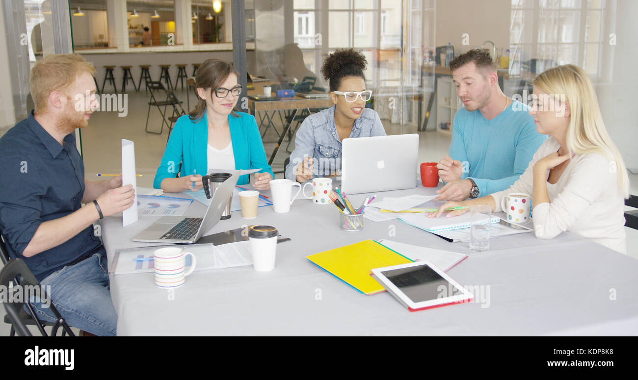 Group of people collaborating in office Stock Photo - Alamy