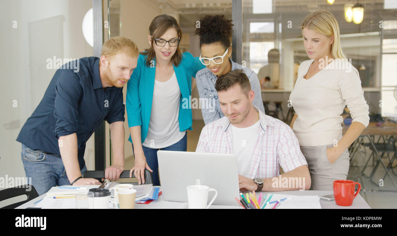 People watching laptop together Stock Photo - Alamy